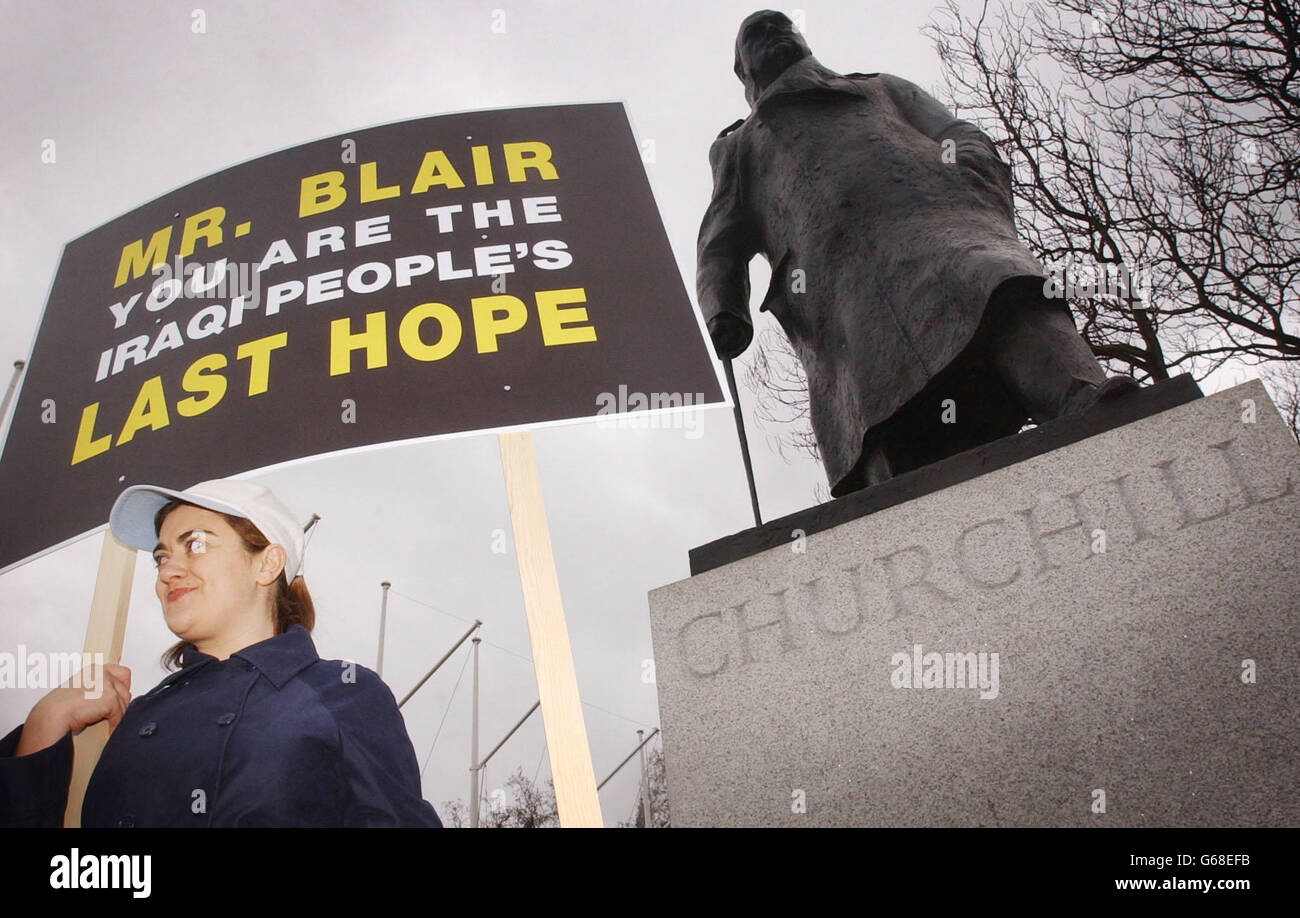A pro-war campaigner in London's Parliament Square shows her support ...