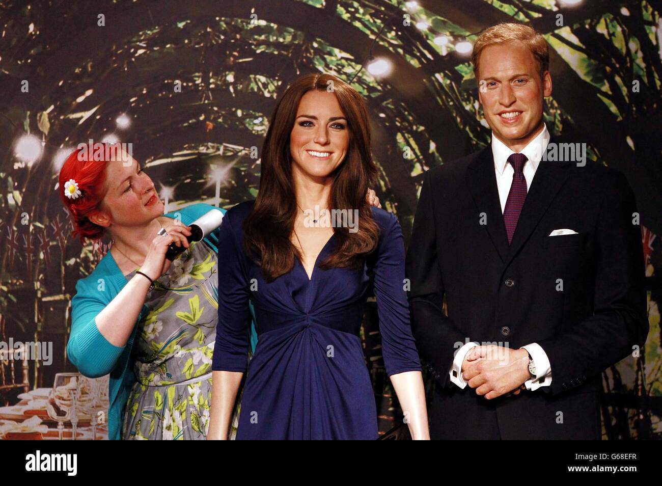 Wardrobe supervisor Jane Anderson makes final adjustments to wax ...