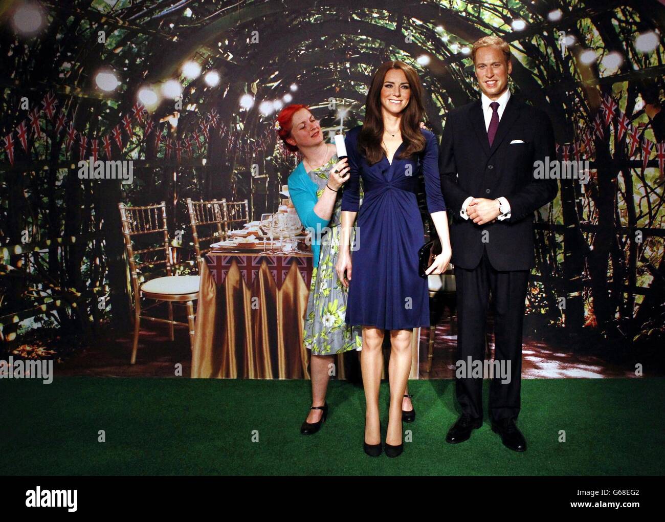 Wardrobe supervisor Jane Anderson makes final adjustments to wax ...