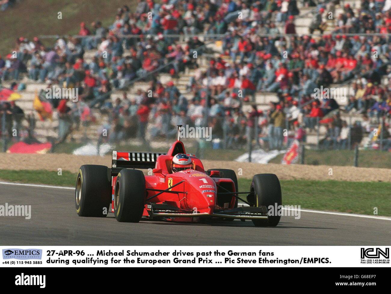 Michael Schumacher drives past the German fans during qualifying for ...
