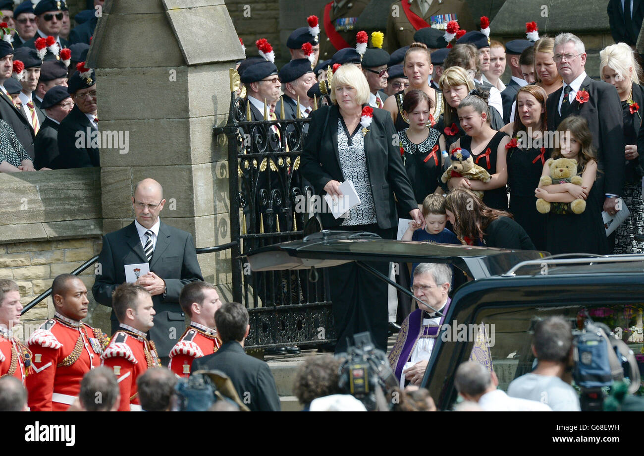 Family members watch as the coffin of murdered Fusilier Lee Rigby is ...
