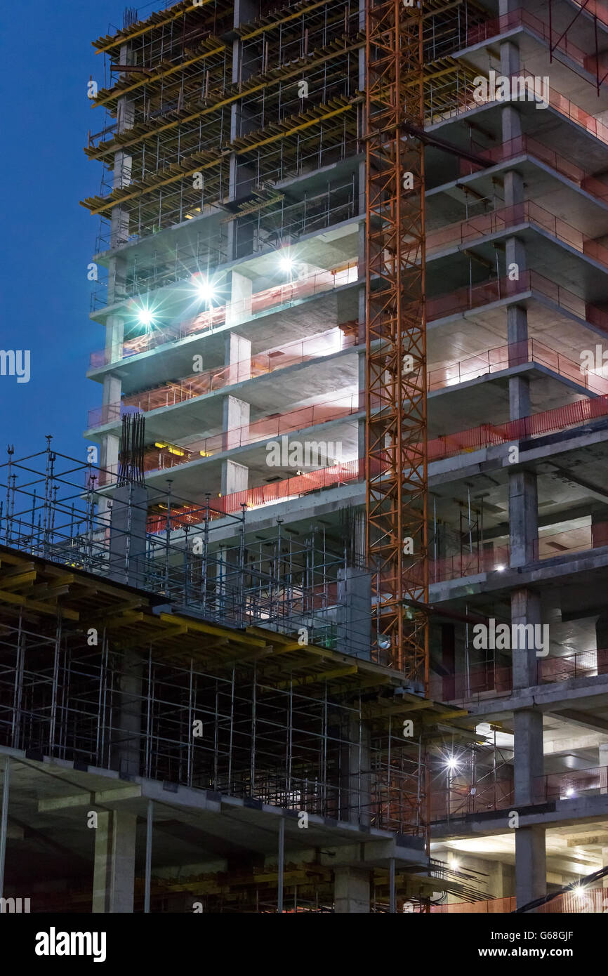Night view of construction site with crane and lights Stock Photo - Alamy