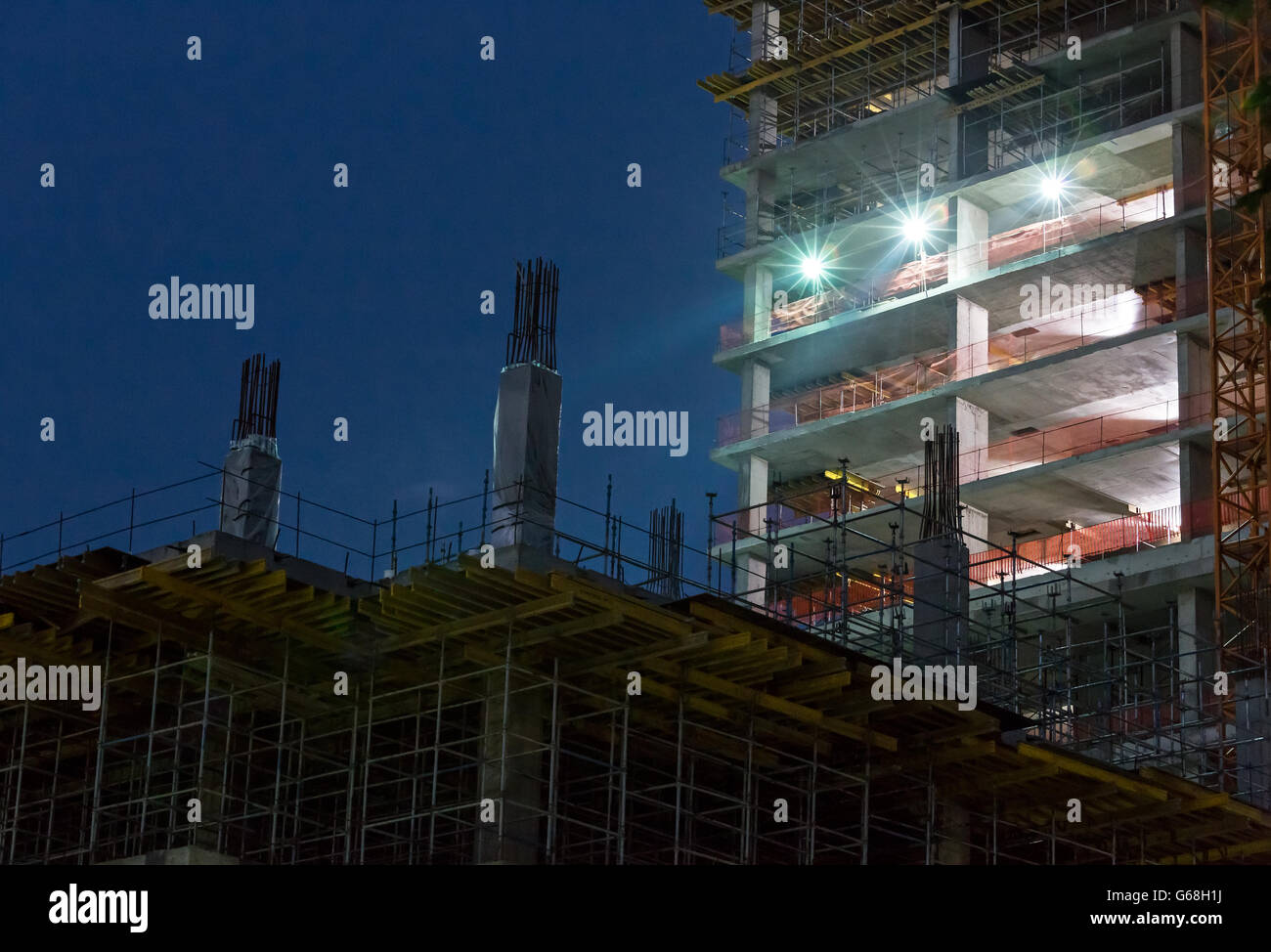Construction site at night with lights against the dark sky Stock Photo ...