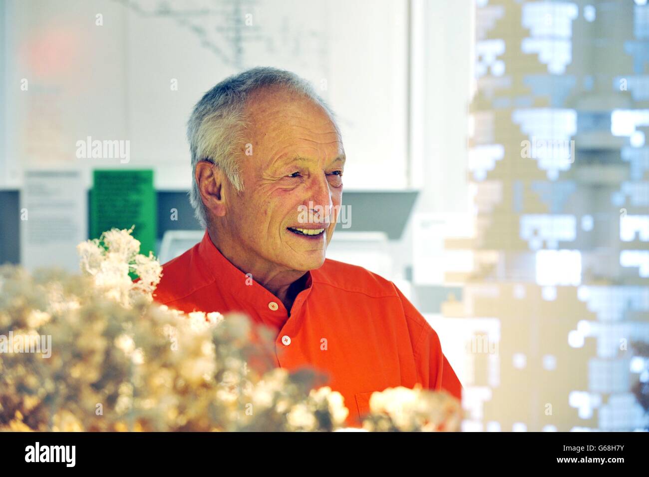 Architect Richard Rogers stands alongside a model of his 1992 design ...