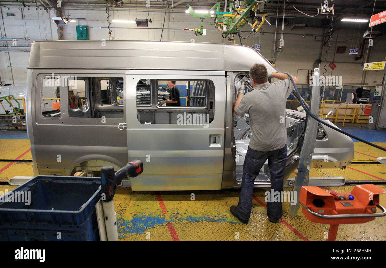 Technicians piece together a Ford Transit van on the production line at ...