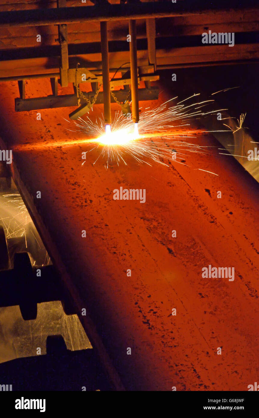 Gas cutting of the hot metal plate Stock Photo - Alamy