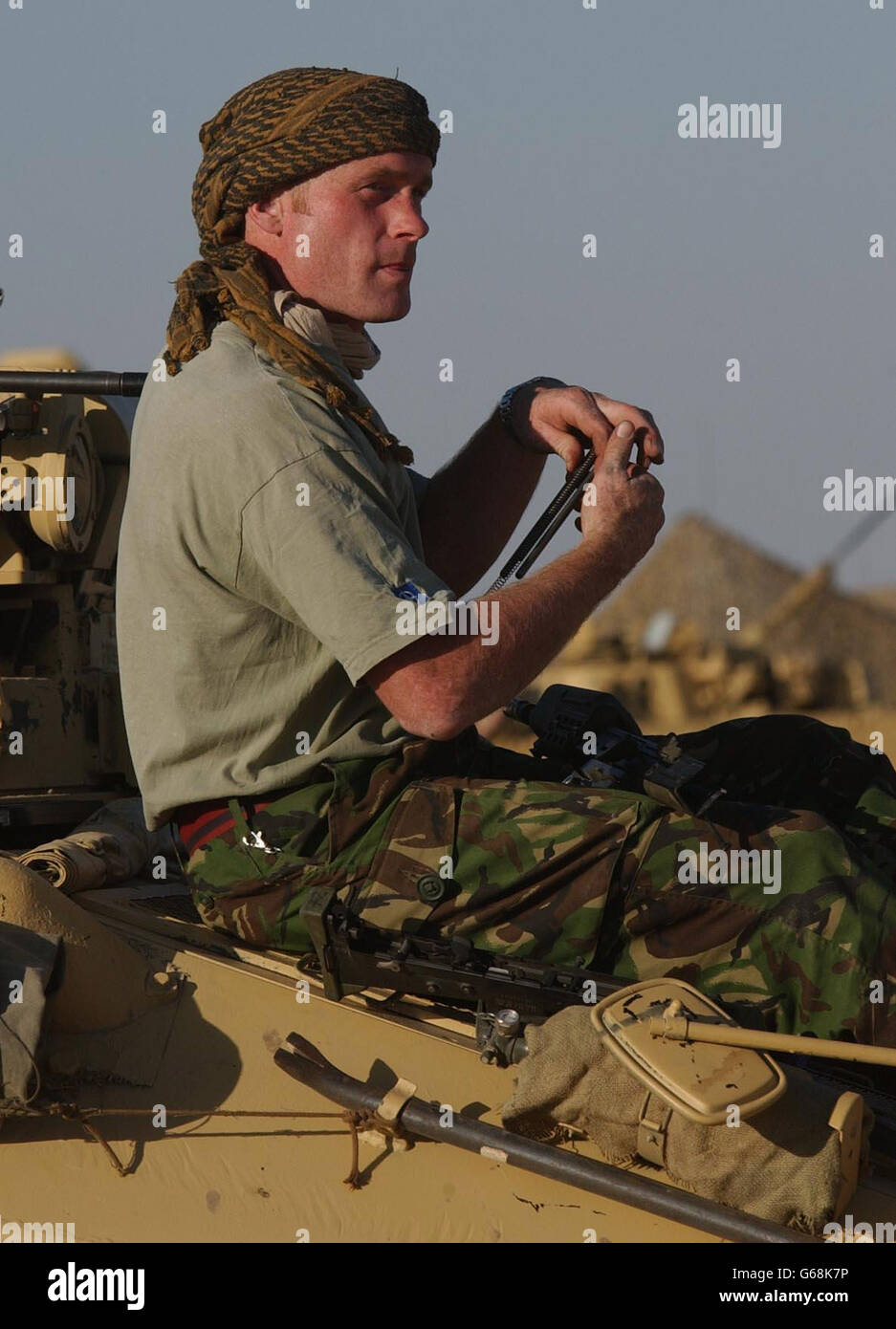 A member of the Royal Scots Dragoon Guards inspects his equipment in ...