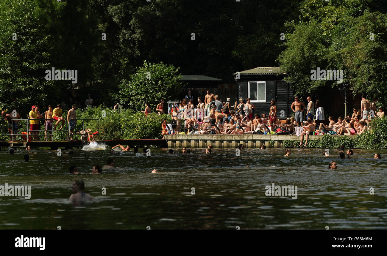 Swimmers and sunbathers enjoying the hot weather in the mixed bathing ...