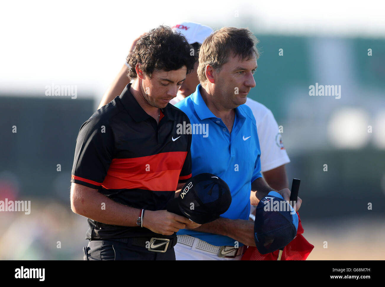 Northern Ireland's Rory McIlroy looks dejected with his caddy JP ...