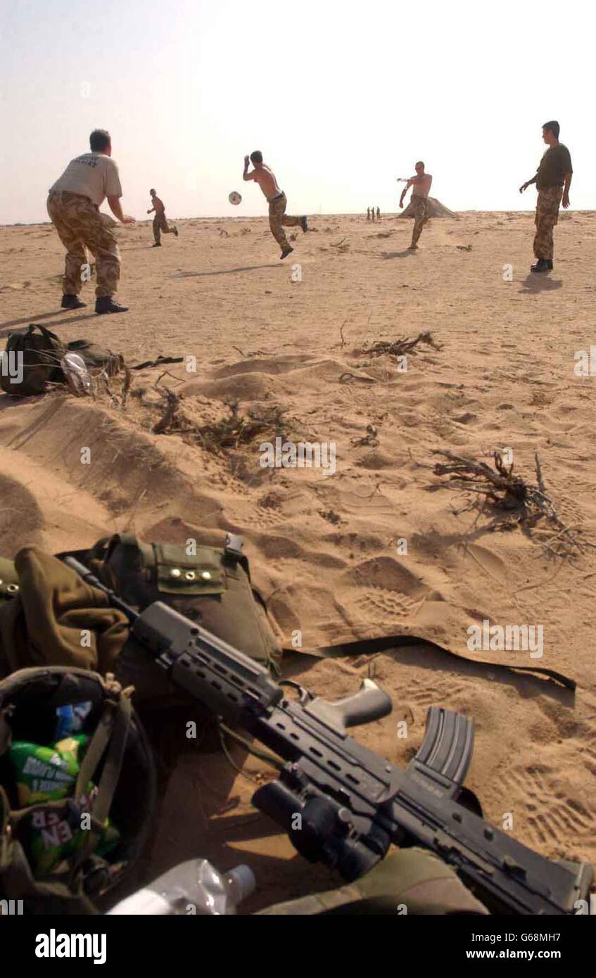 Queens Dragoon Guards playing football. Members of the Queens Dragoon ...