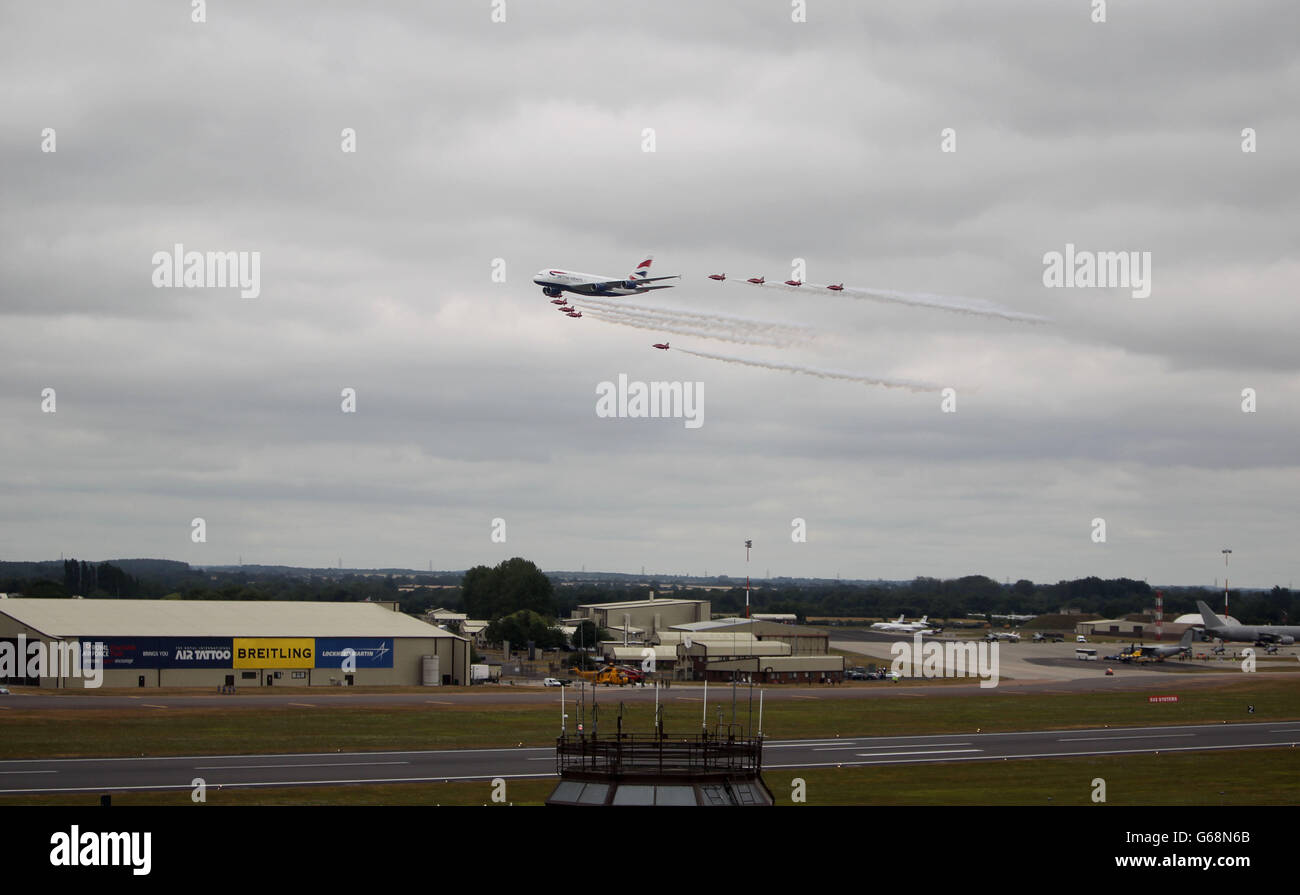 A British Airways Airbus A380 plane displays with the RAF's Red Arrows ...