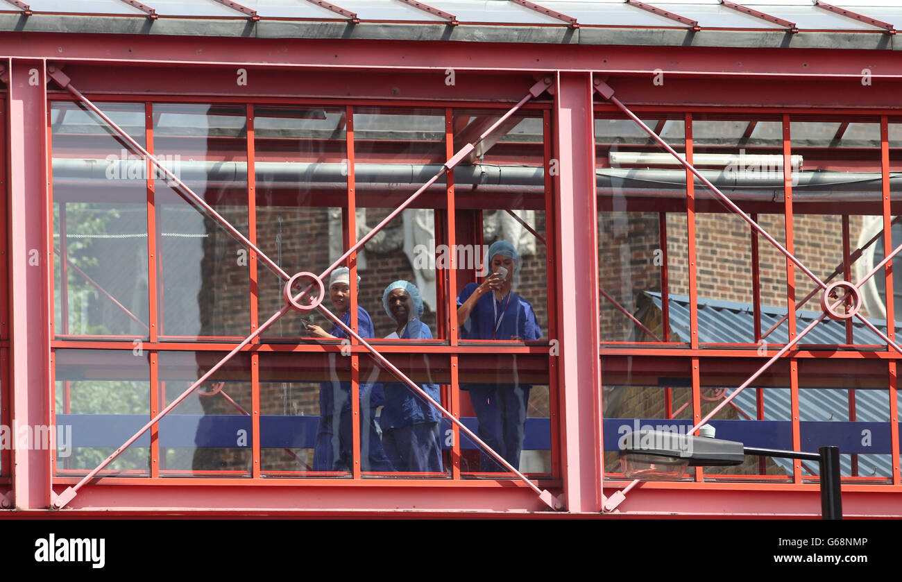 Staff and patients take photographs of media outside the Lindo Wing of ...