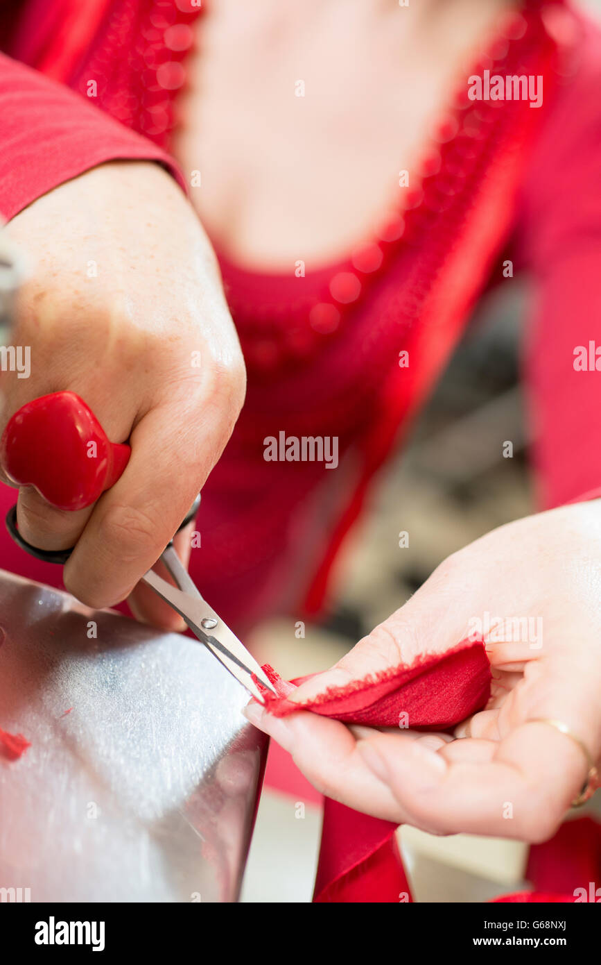 Dressmaker cutting clothes scissors hi-res stock photography and images ...