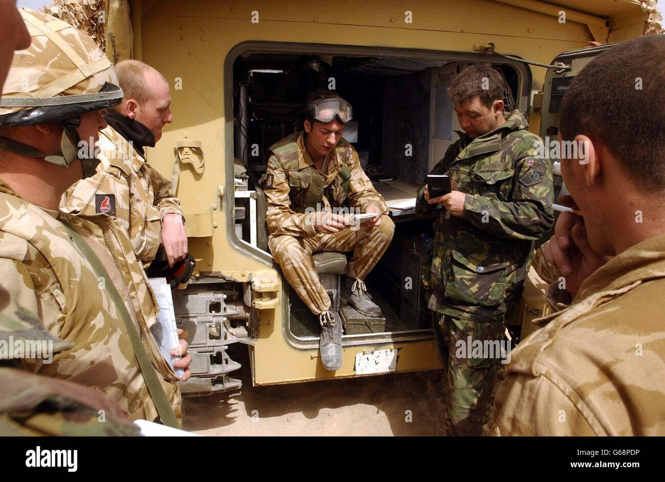 Captain Ralph Lucas briefs his men as the Royal Scots Dragoon Guards ...