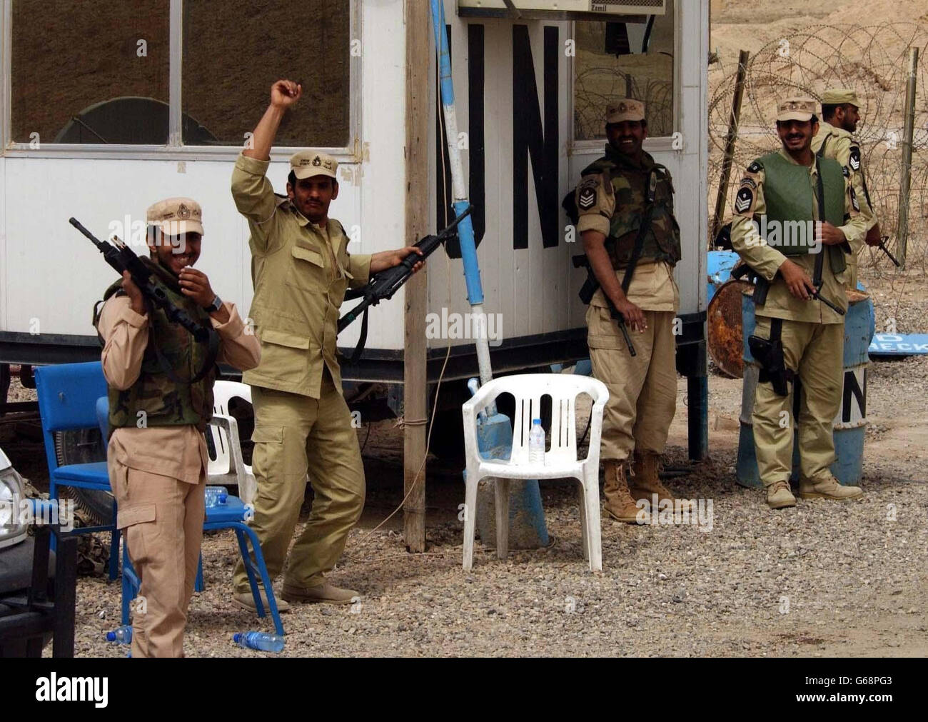 Kuwait soldiers cheer members of the 2nd Royal Tank Regiment as they ...