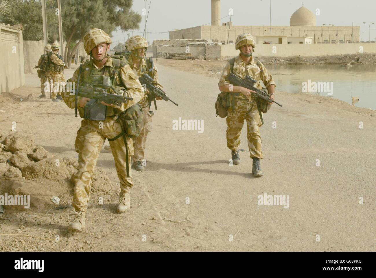 Men from 40 Commando Royal Marines move towards the centre of the town ...