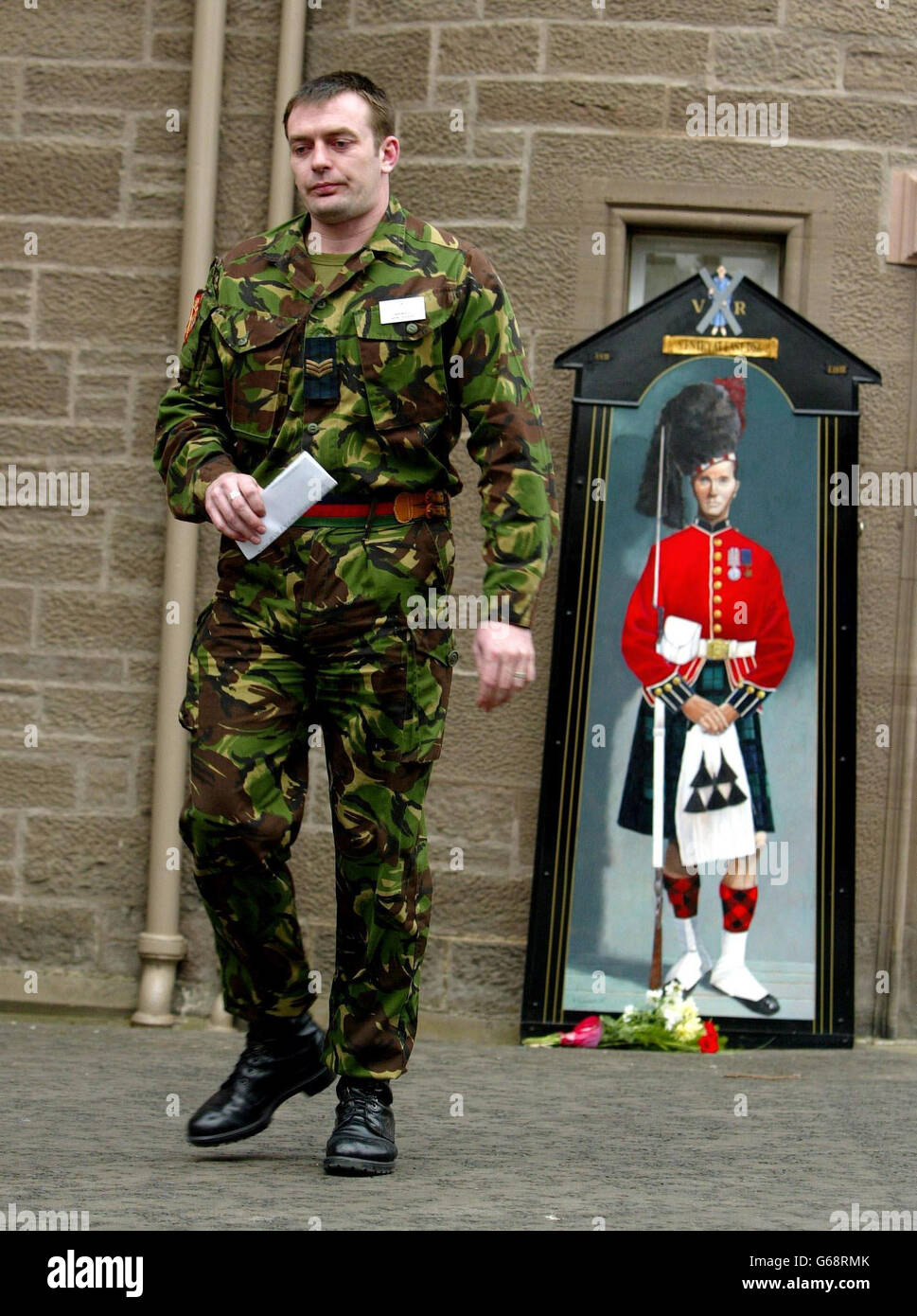 Family friend Sergeant Mark Hudson of the Black Watch reads a statement ...