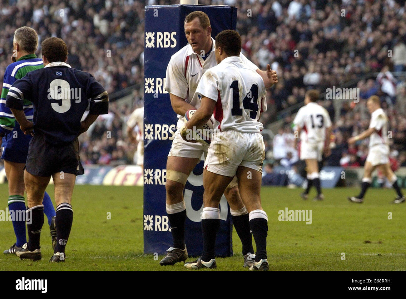 Jason Robinson celebrates one of his trys against Scotland during the ...