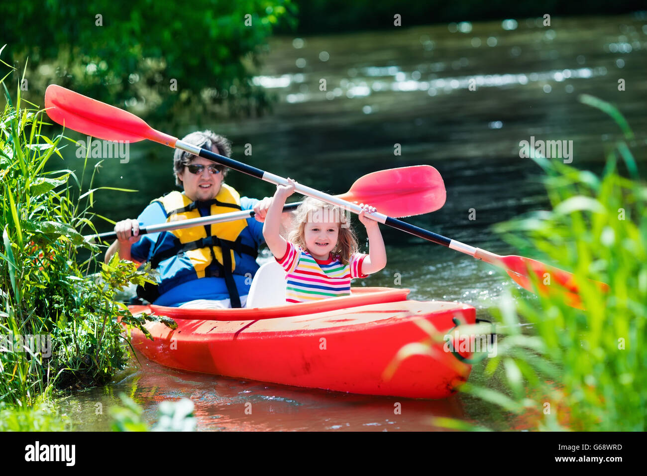 Family on kayaks and canoe tour. Mother and child paddling in kayak in ...
