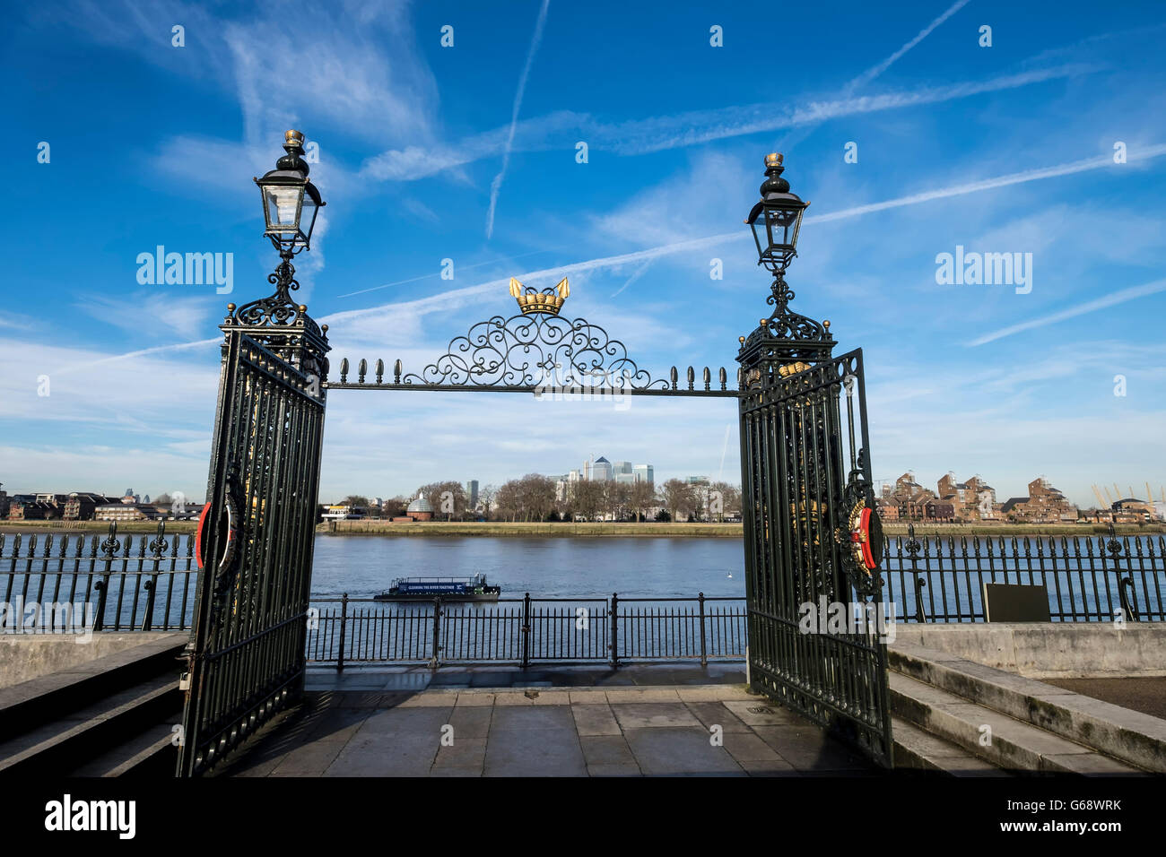 Looking through gates across the River Thames in London from Greenwich ...