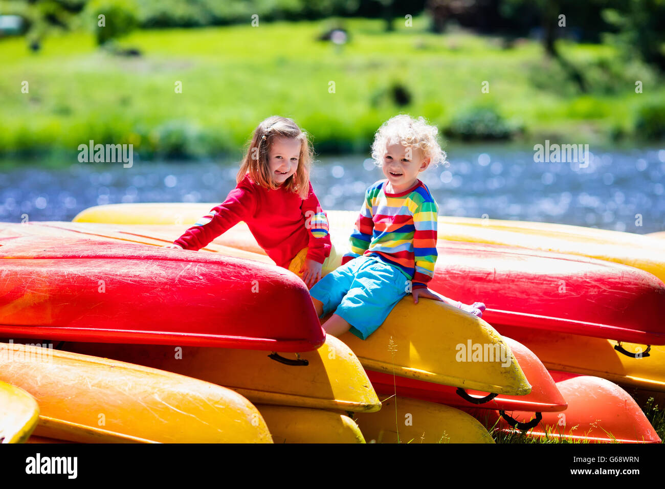 Family on kayaks and canoe tour. Mother and child paddling in kayak in ...