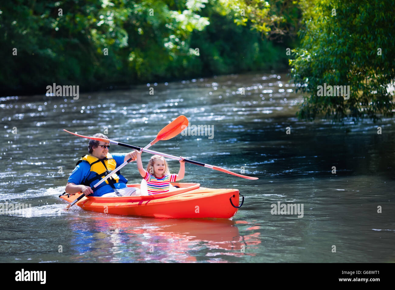 Family on kayaks and canoe tour. Mother and child paddling in kayak in ...