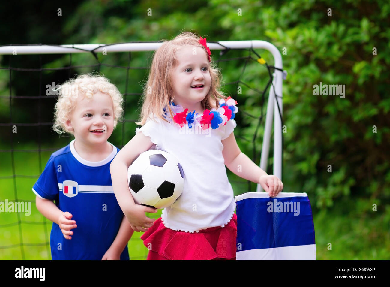 Children cheering and supporting French national football team. Kids ...