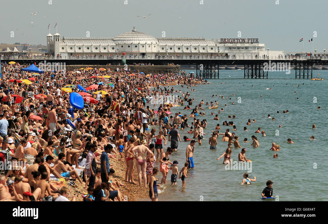 A packed Brighton beach in East Sussex as sunbathers enjoy the sunshine ...