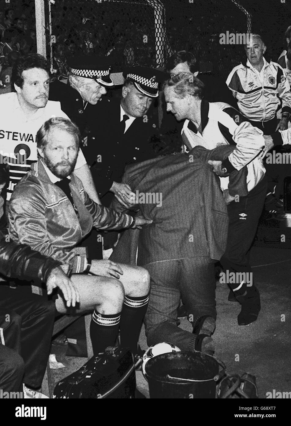 Scotland's legendary soccer manager Jock Stein is helped away after ...