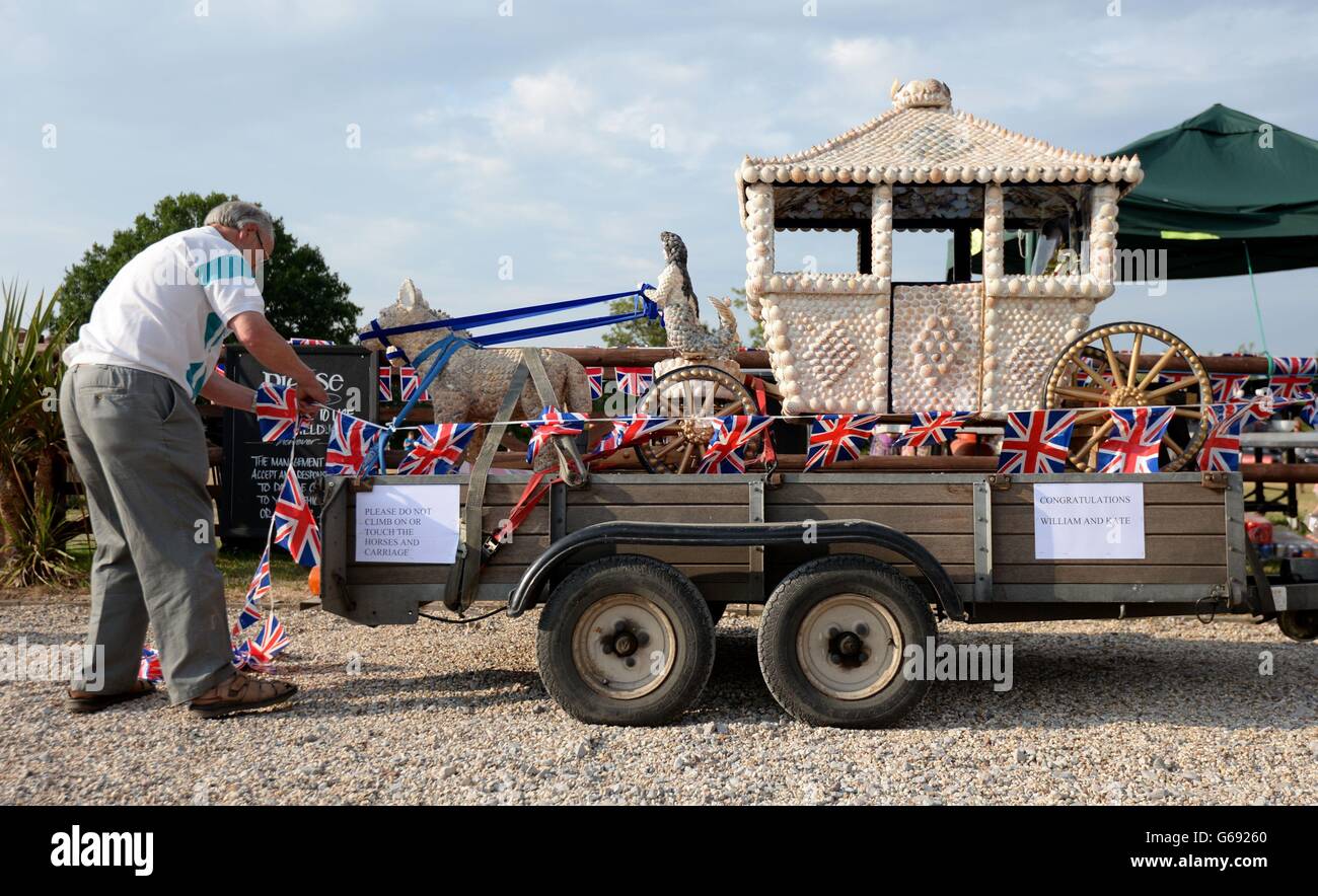 Finishing touches are made to a sea shell carriage carrying pictures of ...