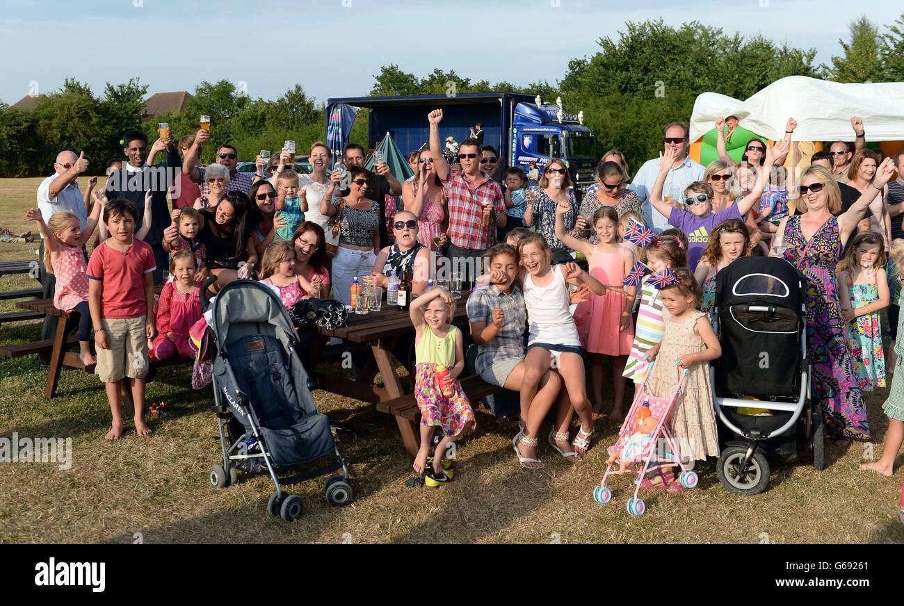 Local villagers gather in a field at the back of the Cottage Inn in ...