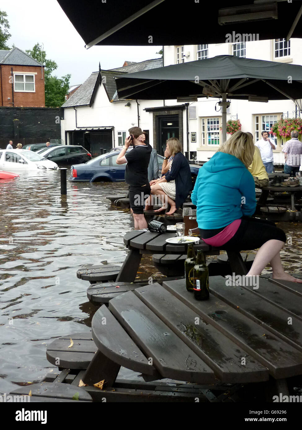Worried car owners outside The Grosvenor pub in Nottingham as a sudden ...