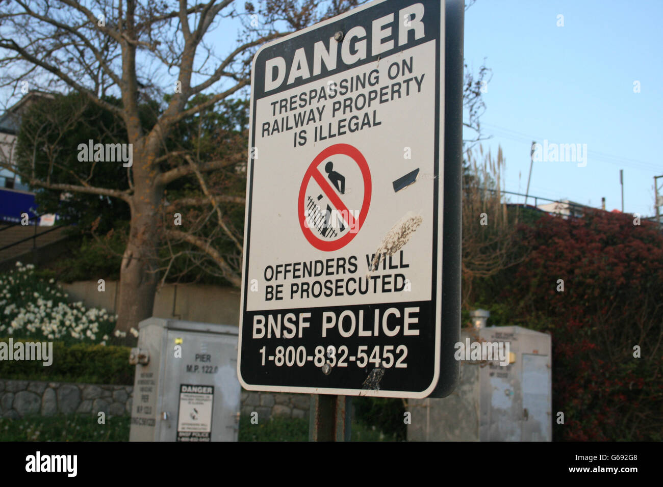 Trespassing warning street sign BNSF Police Stock Photo - Alamy