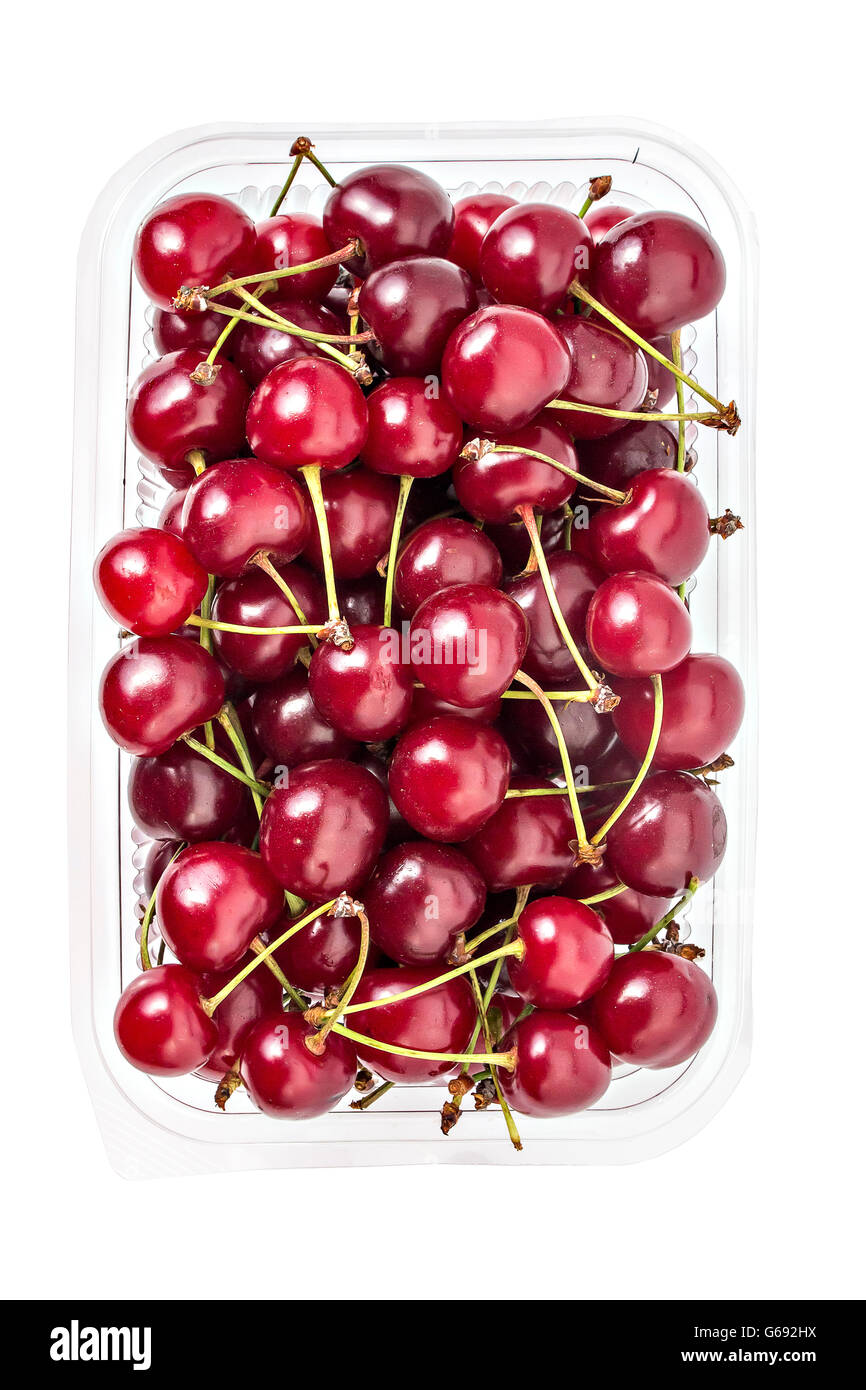 Box or punnet of fresh ripe organic sour cherries isolated on white ...