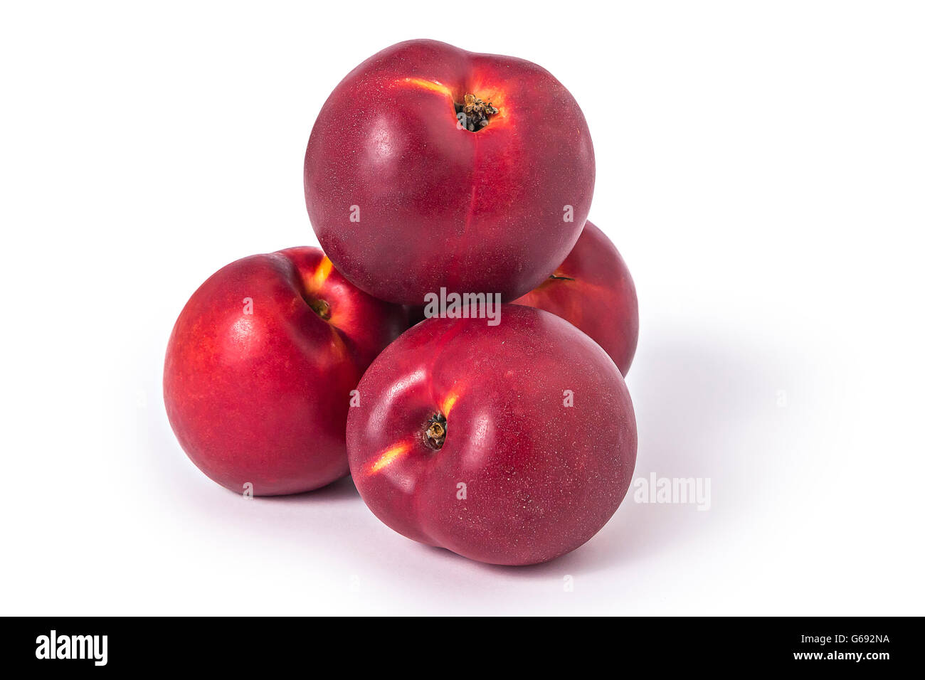 Pile of fresh ripe organic nectarines isolated on white background ...
