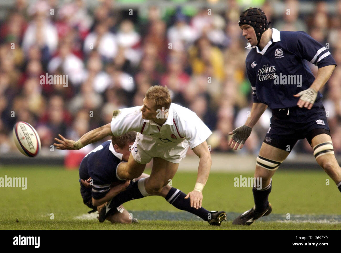 England full back Josh Lewsey gets the ball away under pressure from ...