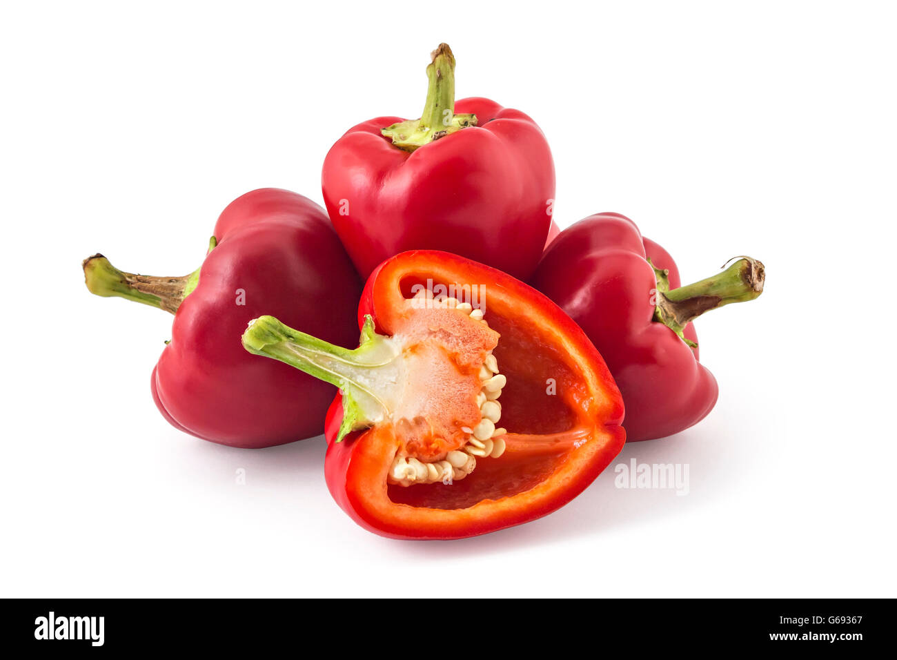 Three fresh hot red bell peppers and one cutted, isolated on white ...