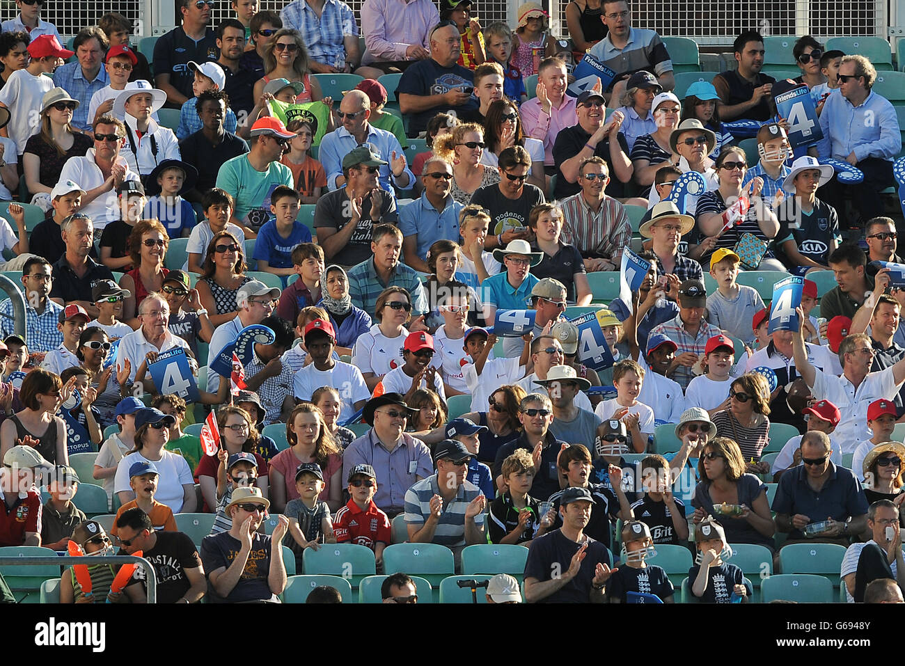 The crowd enjoy the action from the stands at the Kia Oval Stock Photo ...