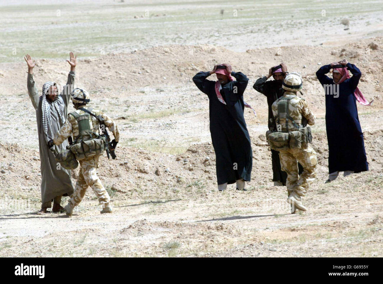 Gurkhas search occupants of a vehicle west of Basra, Iraq. Two Puma ...