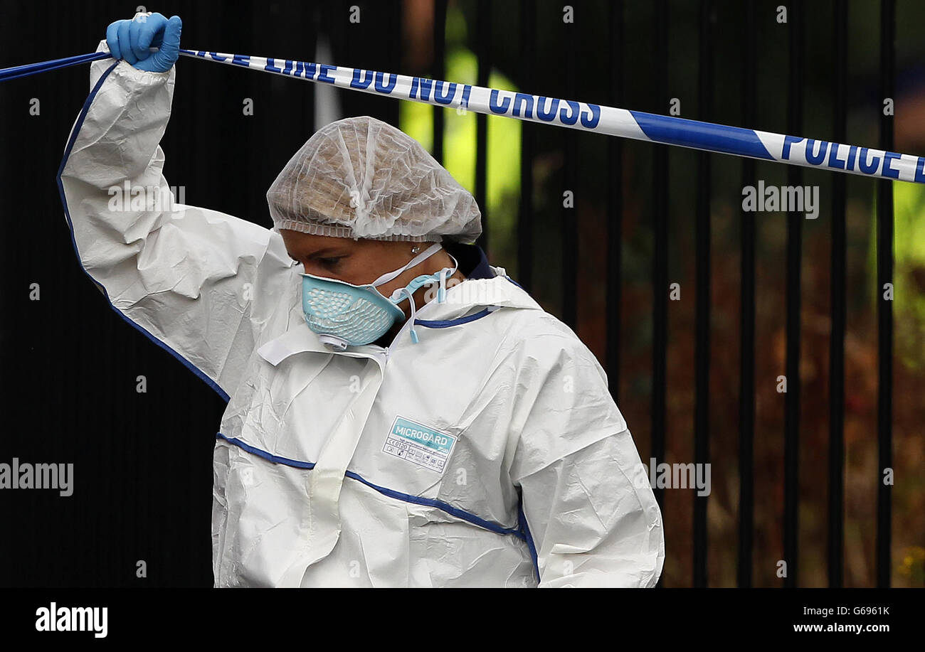 Police forensic officers working at the scene of a stabbing in Moston ...