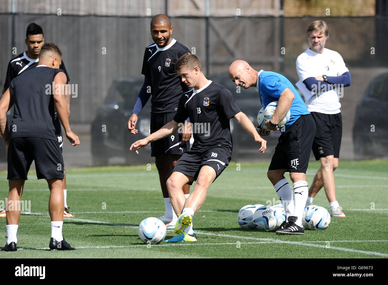 Coventry City manager Steven Pressley (right) and Pete Tierney (second ...
