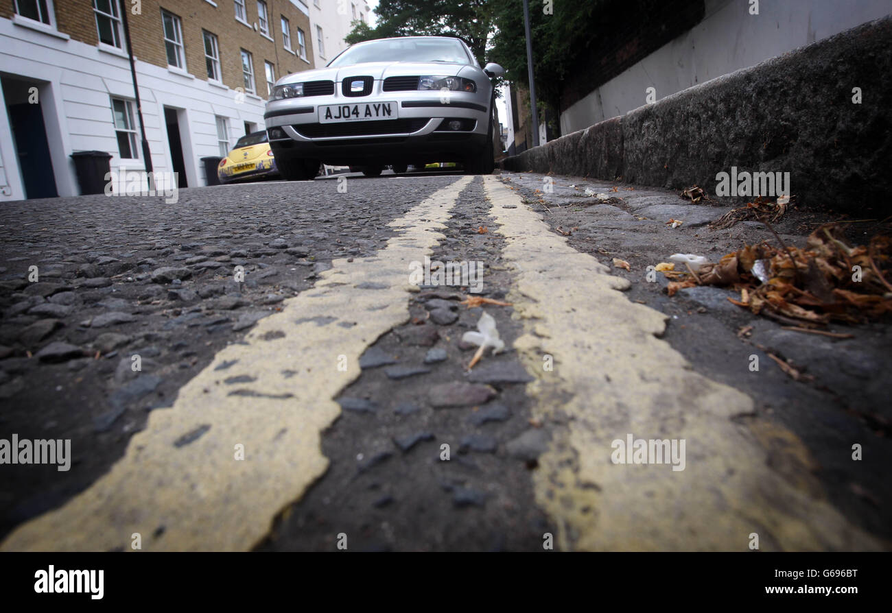 Double yellow lines Stock Photo - Alamy
