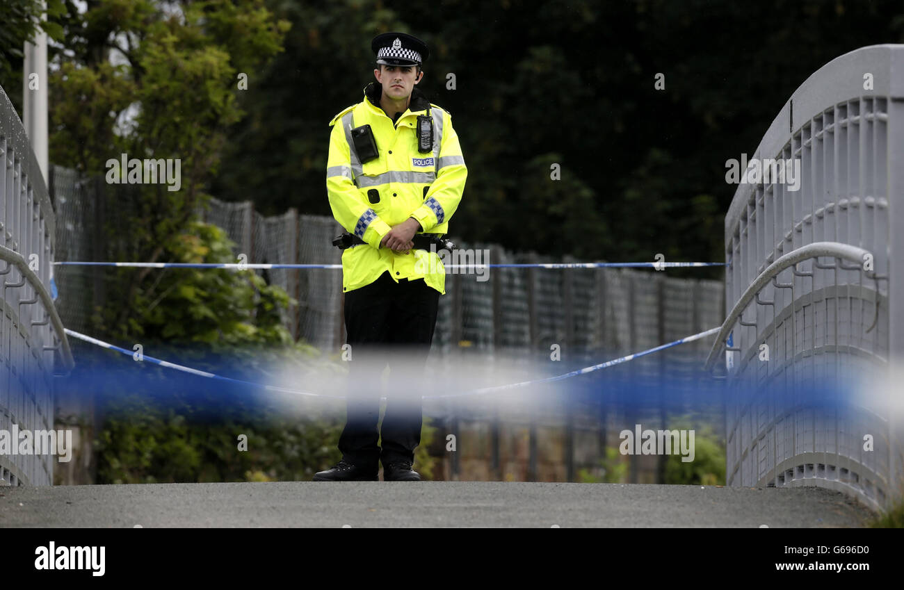 A police officer guards the scene after the remains of a baby were ...