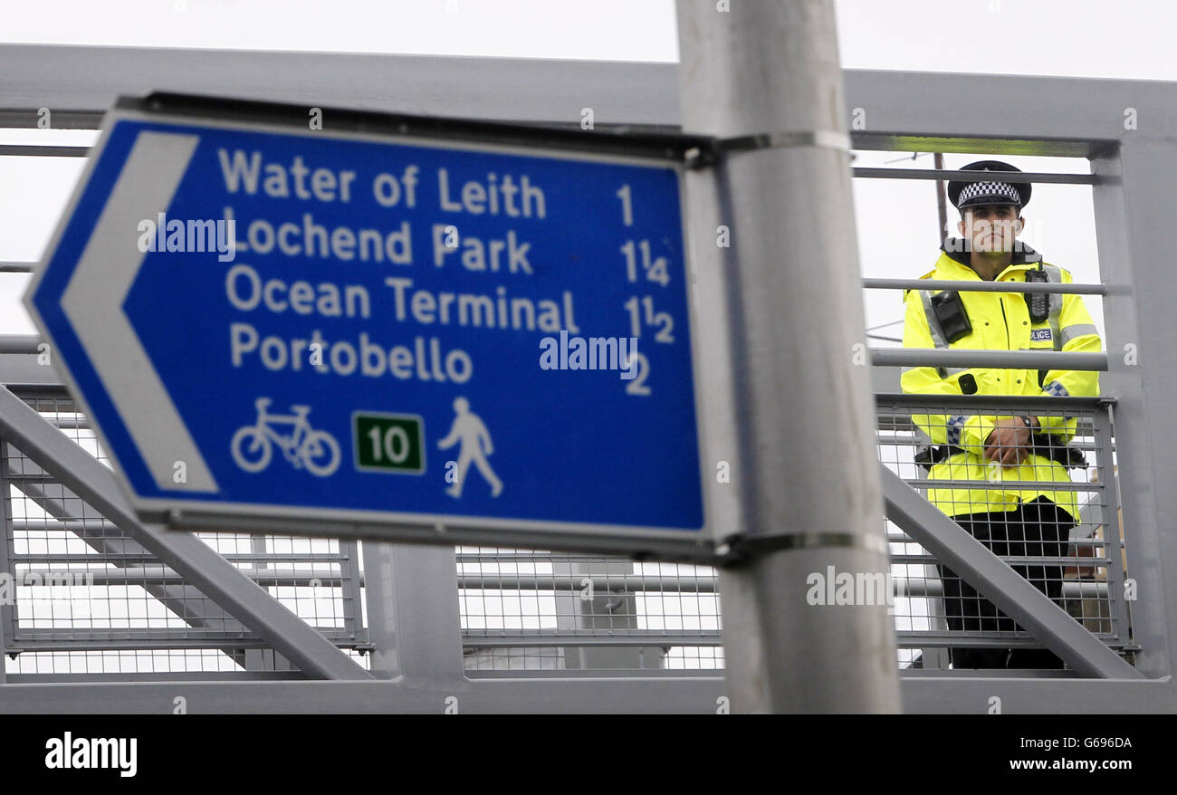 A police officer guards the scene after the remains of a baby were ...