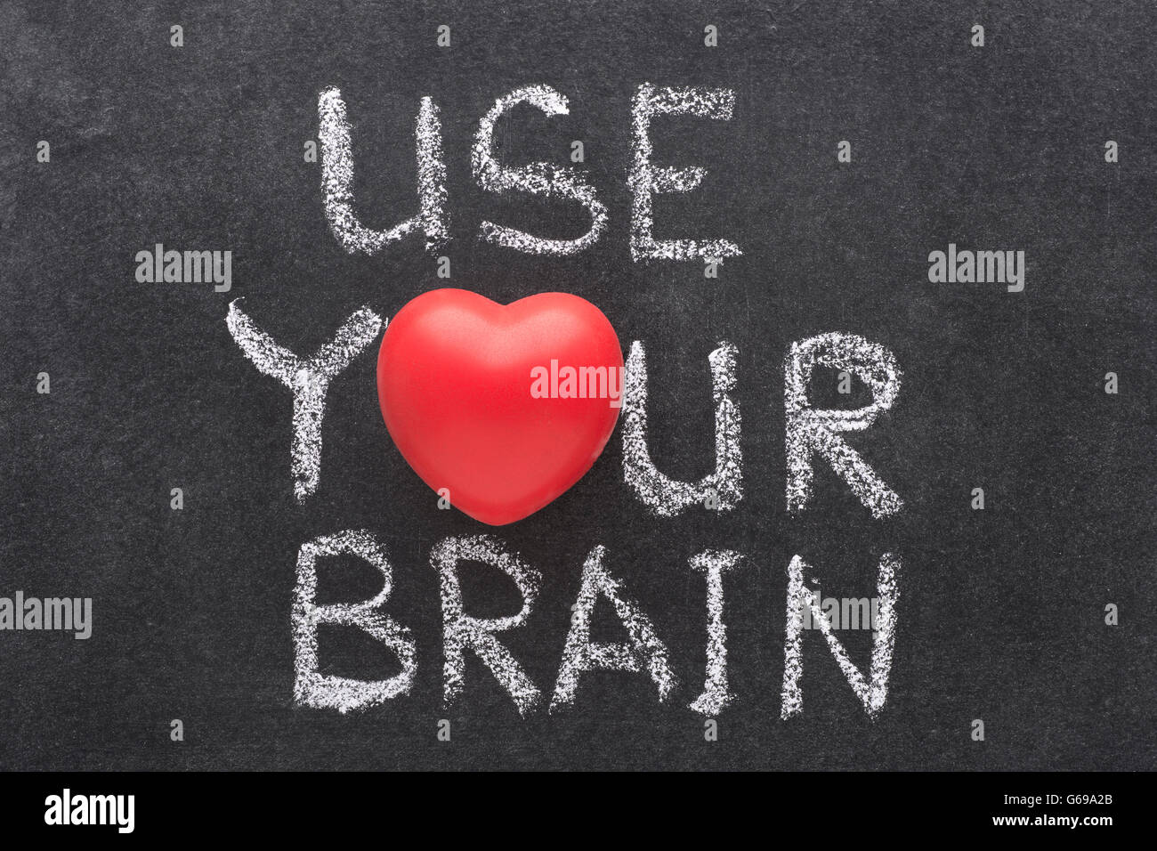 use your brain phrase handwritten on chalkboard with heart symbol ...