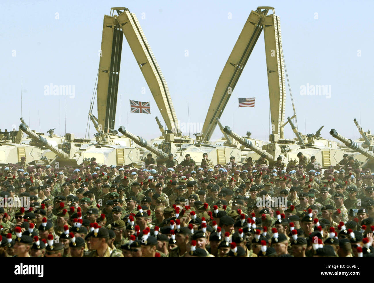 Tanks and soldiers of the British 90 Armoured Engineer Bridges form a ...
