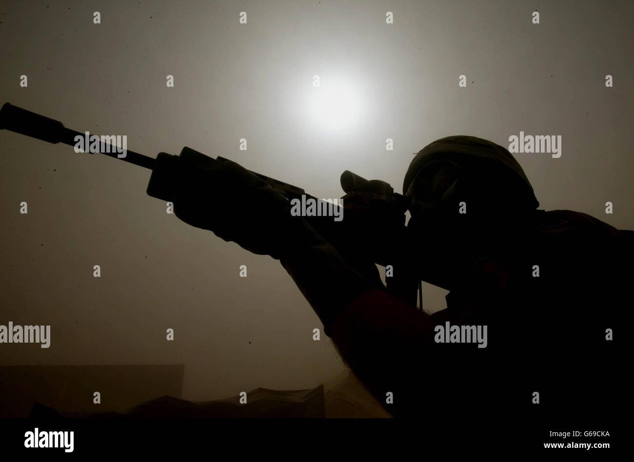 A British soldier in position during a sandstorm in the Kuwaiti desert ...
