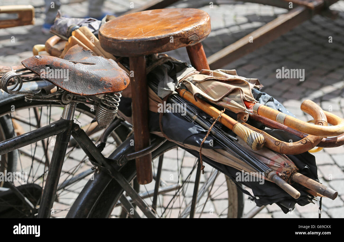 very old bicycle with many old broken umbrellas Stock Photo - Alamy