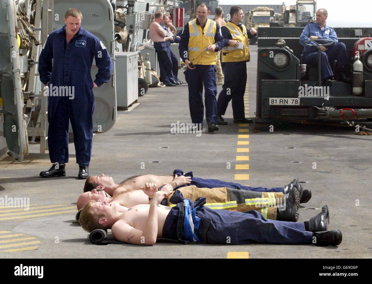 The crew on board the helicopter carrier HMS Ocean, take a break whilst ...