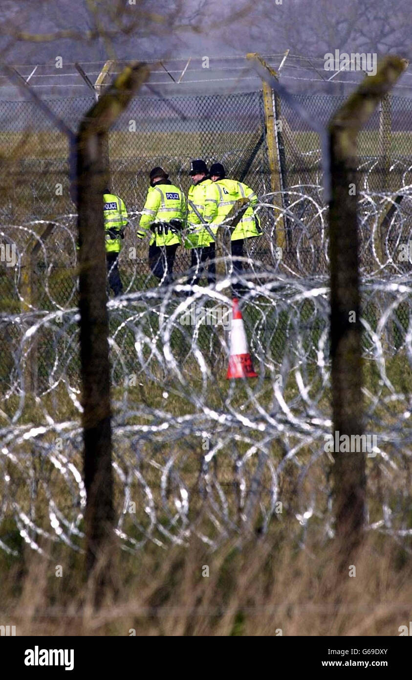 Police patrol the perimeter fence at raf fairford hi-res stock ...